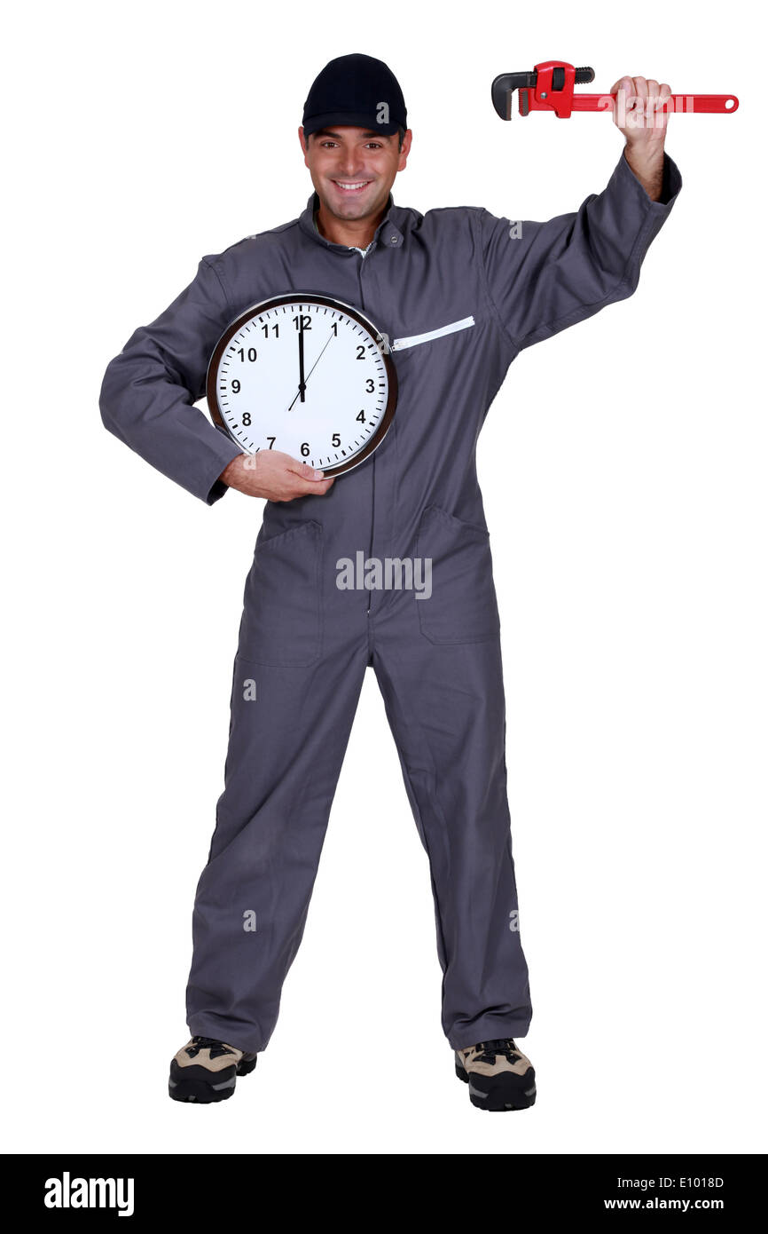 Mechanic with a clock Stock Photo - Alamy