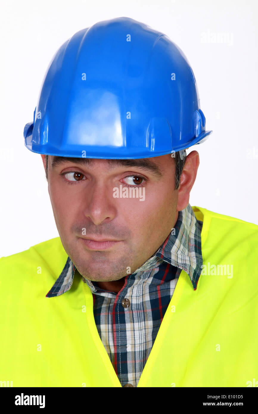 Nervous construction worker Stock Photo - Alamy