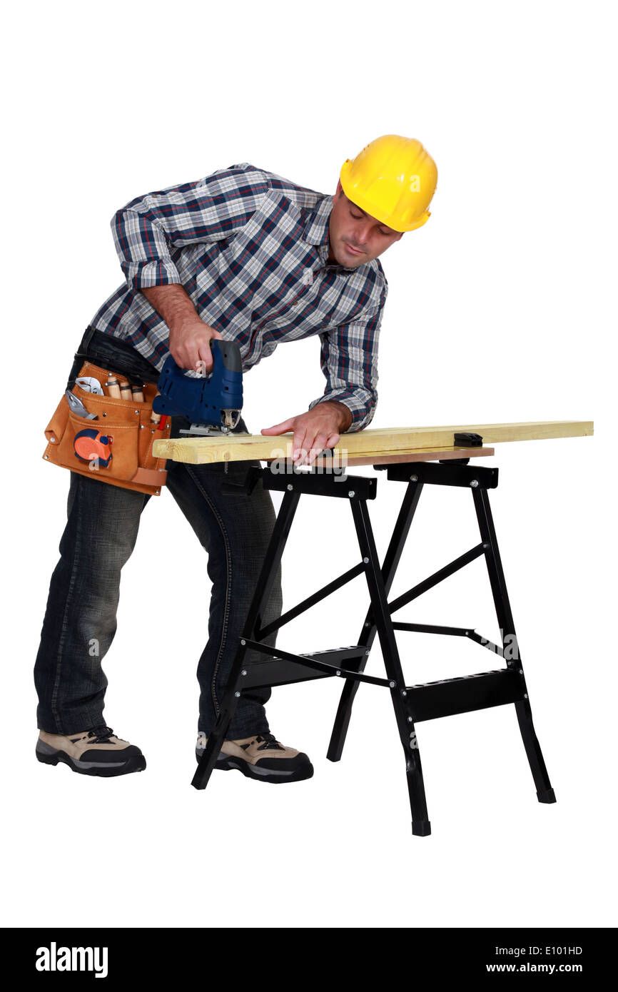 Person sawing some wood Cut Out Stock Images & Pictures - Alamy