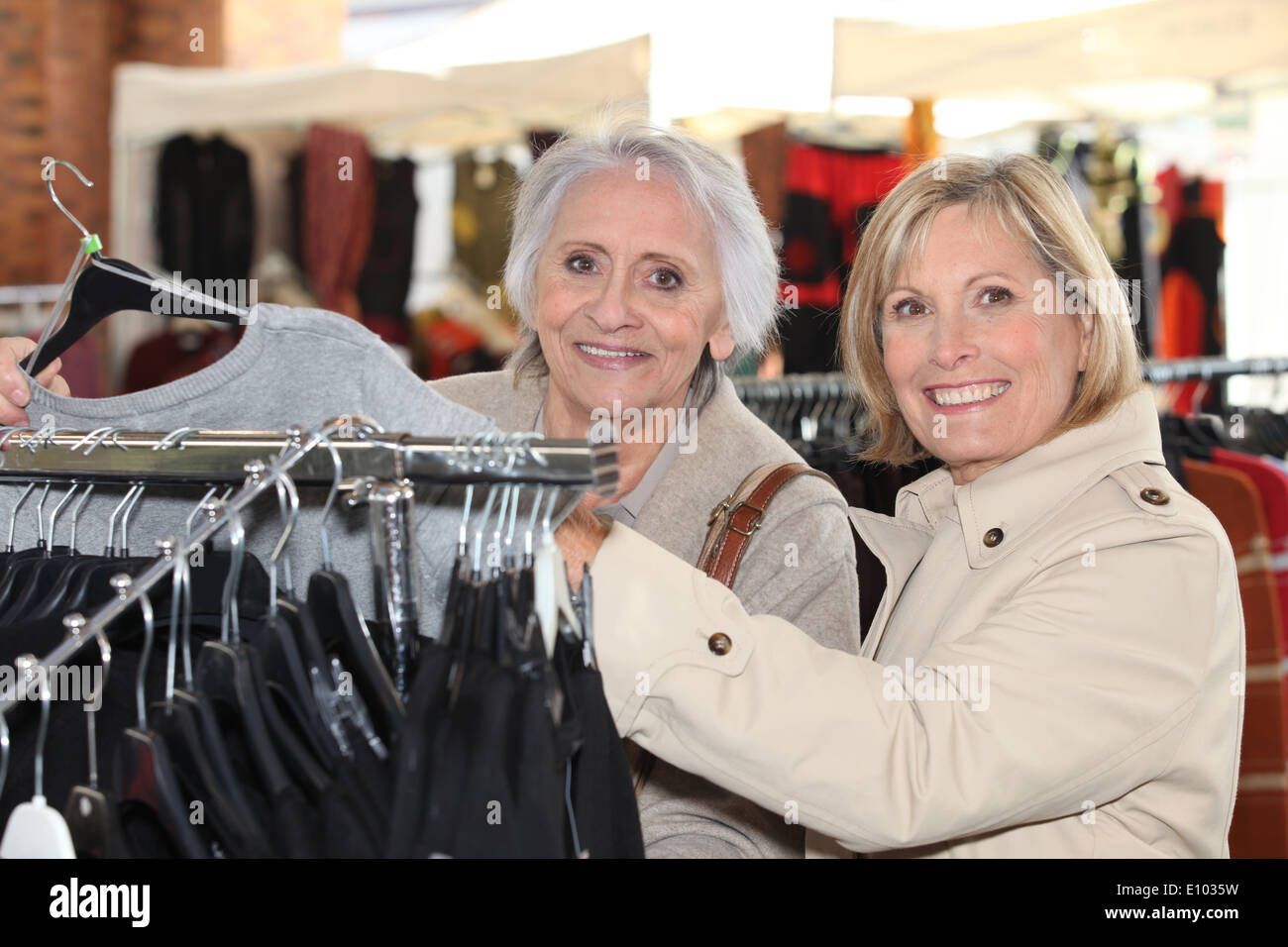Two women clothes hangers hi-res stock photography and images - Alamy