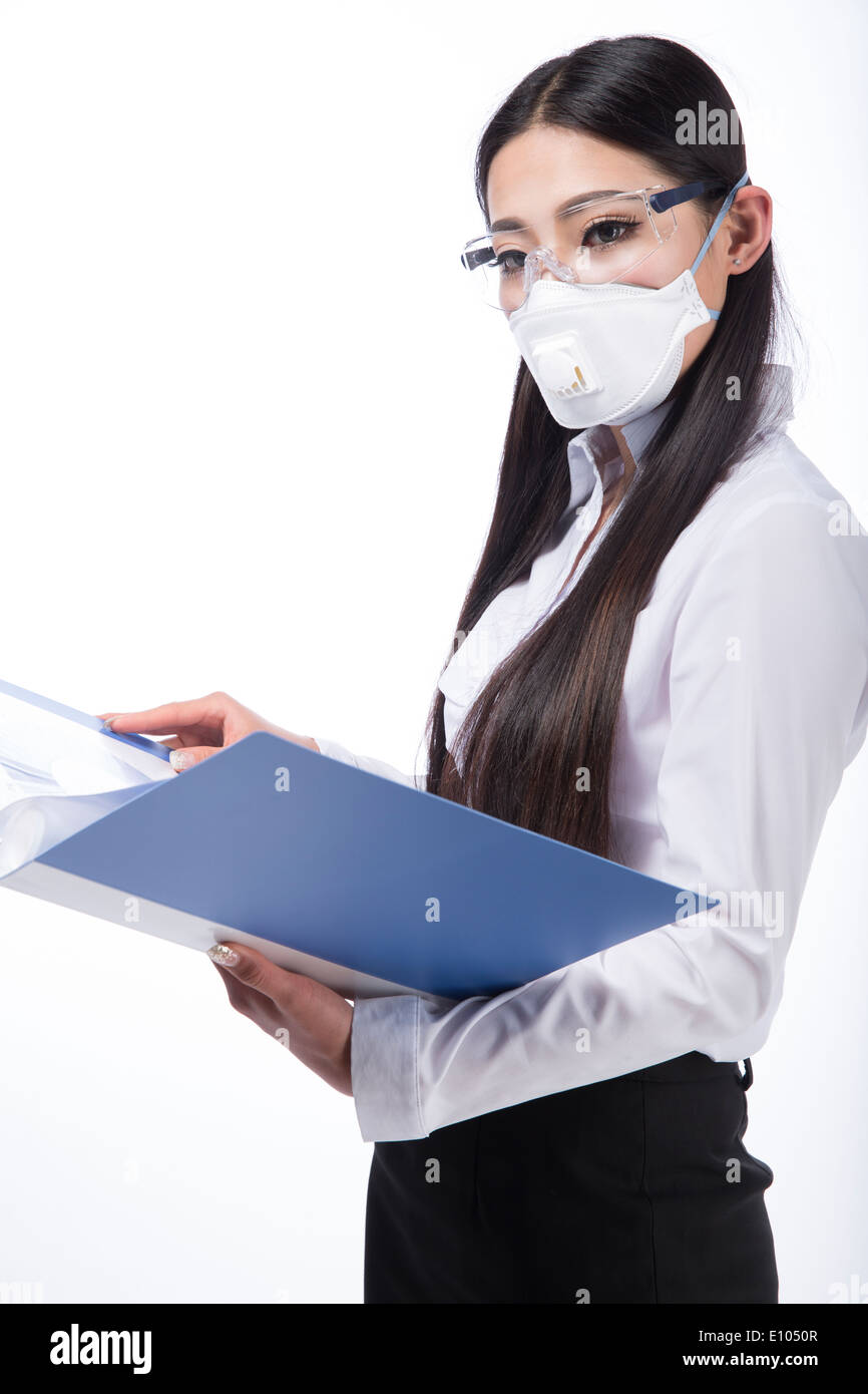 black hair girl with a mask on her face. Isolated on white Stock Photo ...