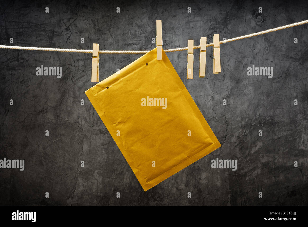 Postal mail Envelope hanging on rope attached with clothes pins ...