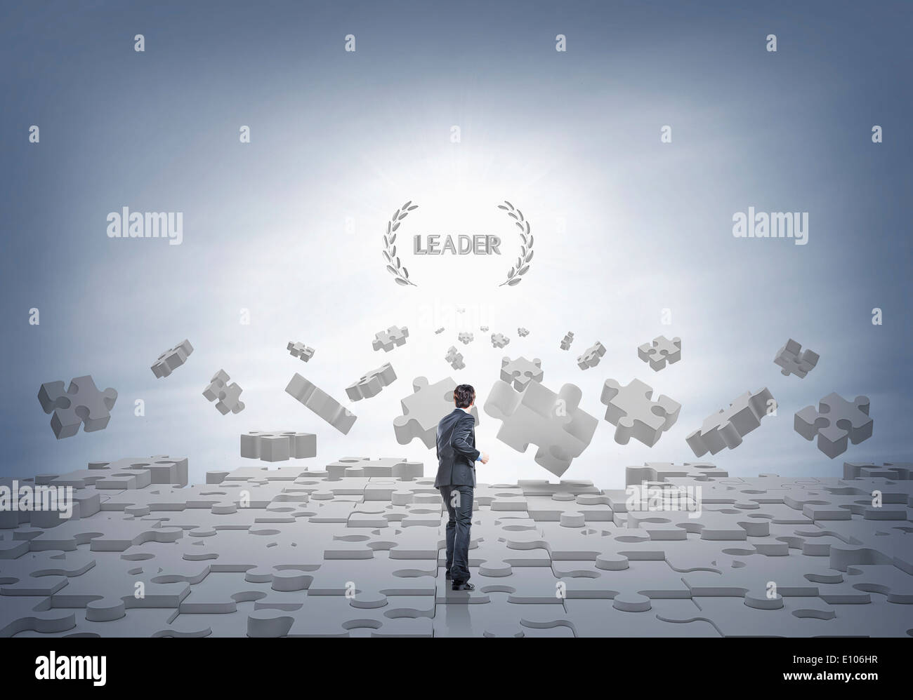 a business man looking at the word leader Stock Photo - Alamy