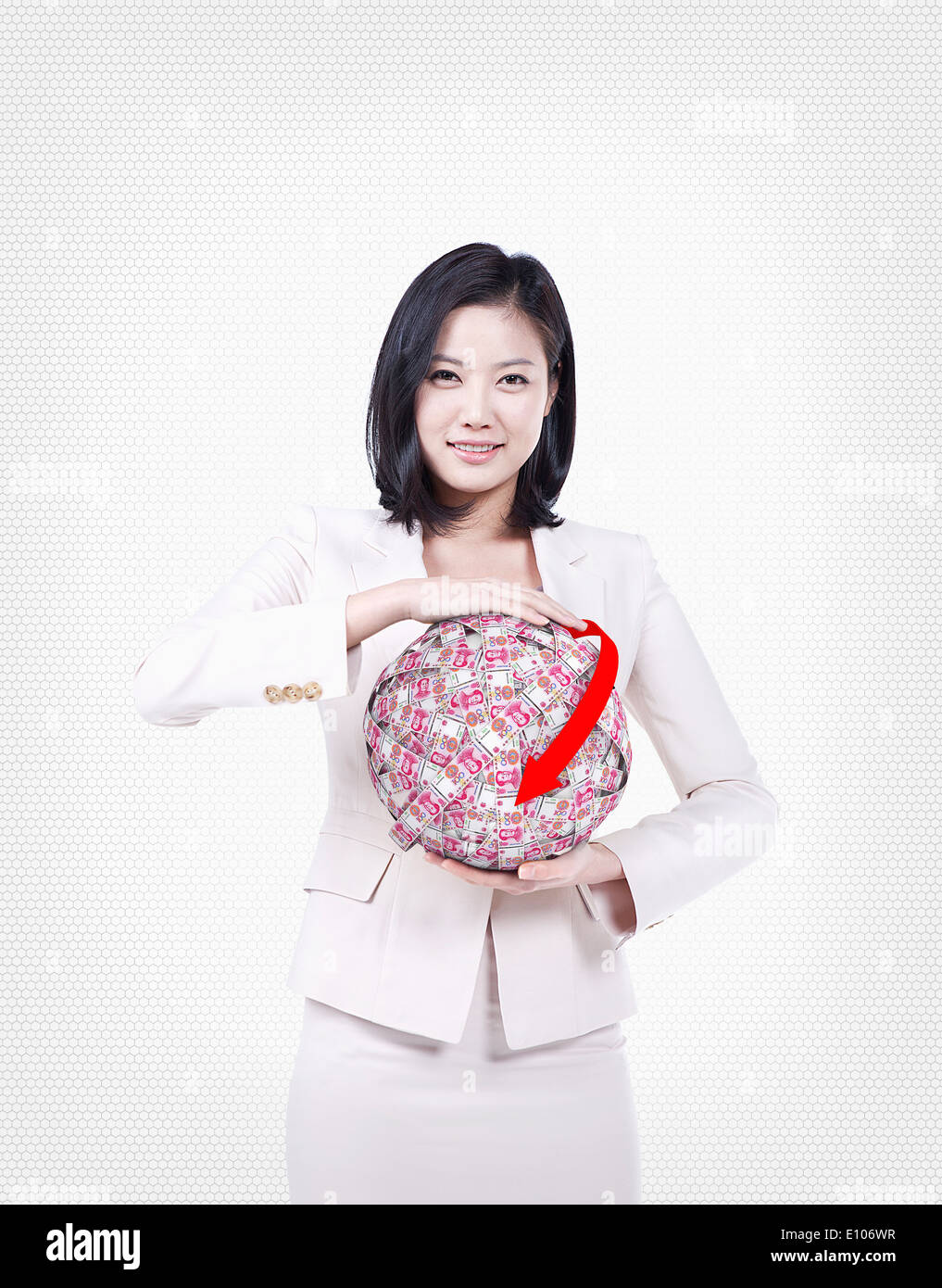 a business woman holding a ball of money Stock Photo - Alamy