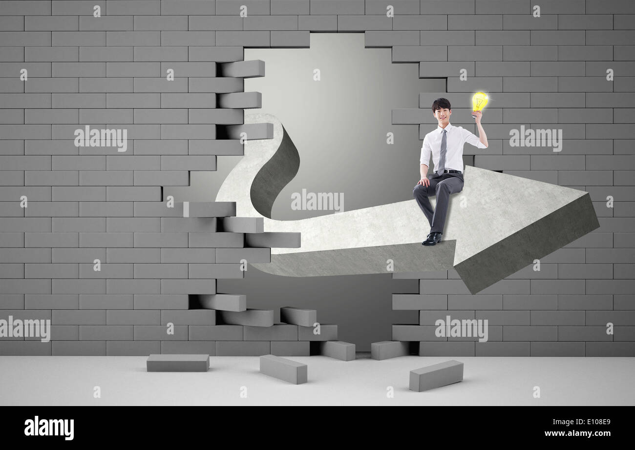 a business man riding an arrow Stock Photo - Alamy