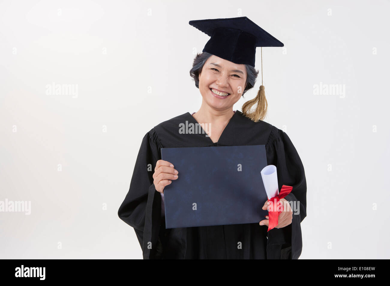 an old woman wearing a graduation outfit Stock Photo - Alamy