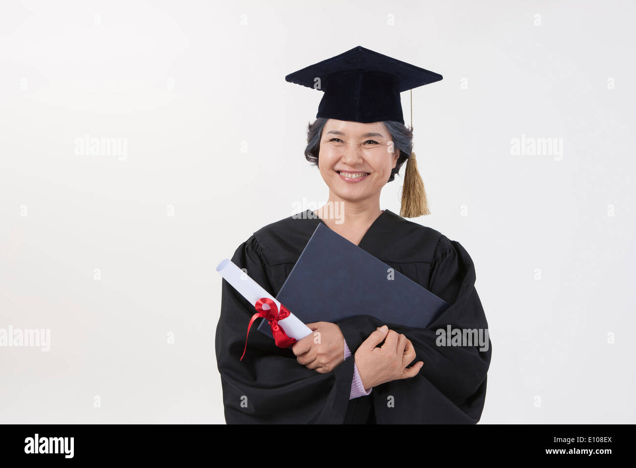 an old woman wearing a graduation outfit Stock Photo - Alamy