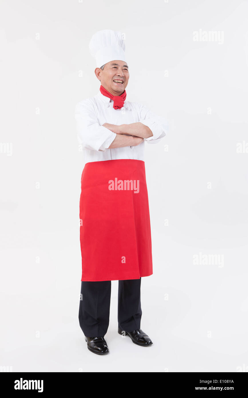 an old man wearing a chefs uniform Stock Photo - Alamy