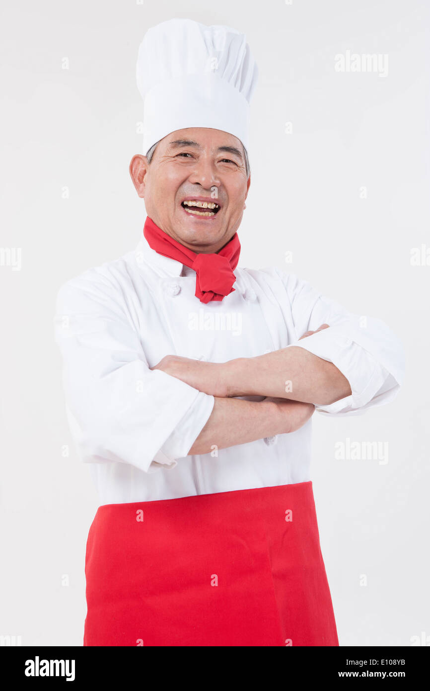 an old man wearing a chefs uniform Stock Photo - Alamy