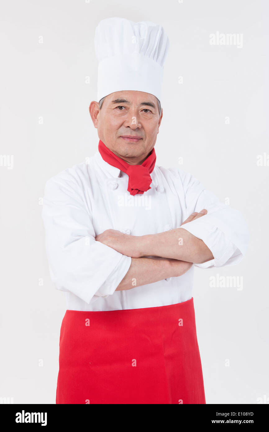 an old man wearing a chefs uniform Stock Photo - Alamy