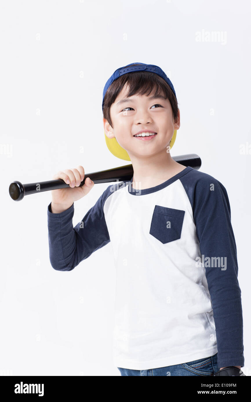a young boy posing with a baseball bat Stock Photo - Alamy