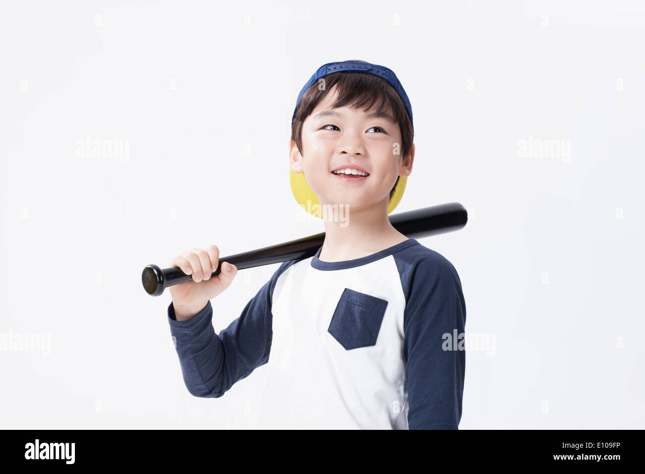 a young boy posing with a baseball bat Stock Photo - Alamy