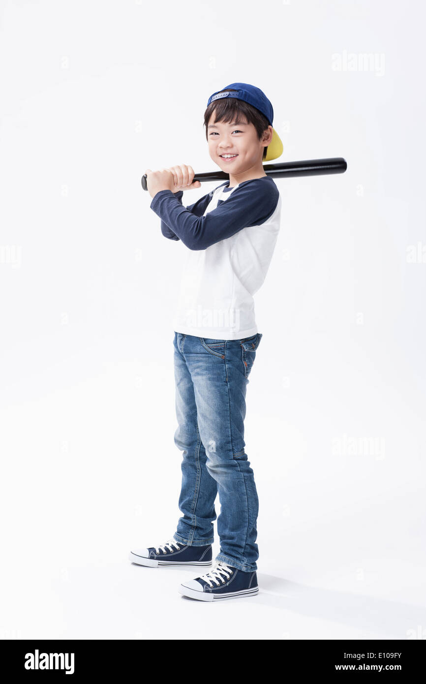 a young boy posing with a baseball bat Stock Photo - Alamy
