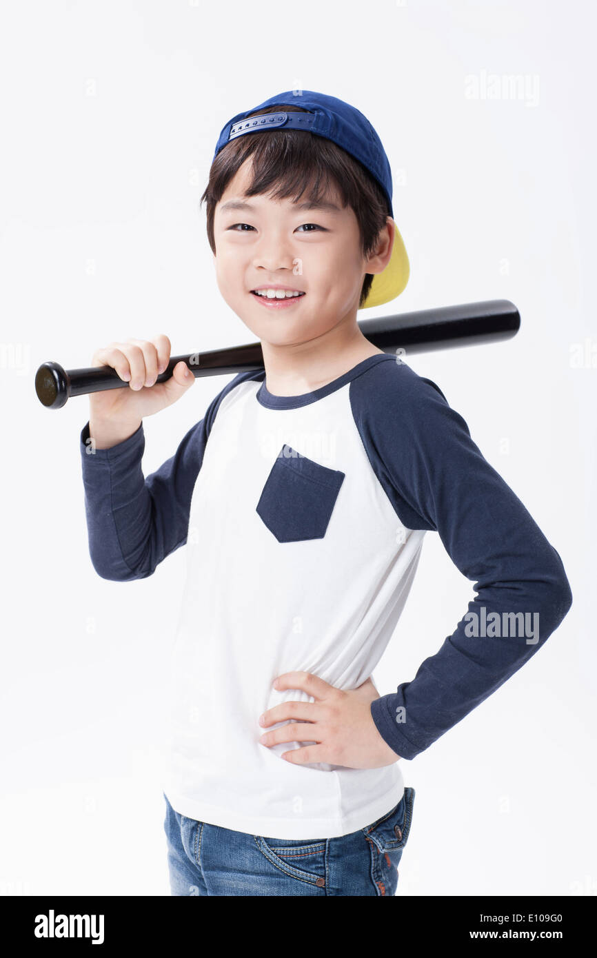 a young boy posing with a baseball bat Stock Photo - Alamy