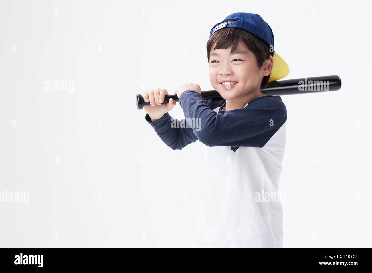a young boy posing with a baseball bat Stock Photo - Alamy