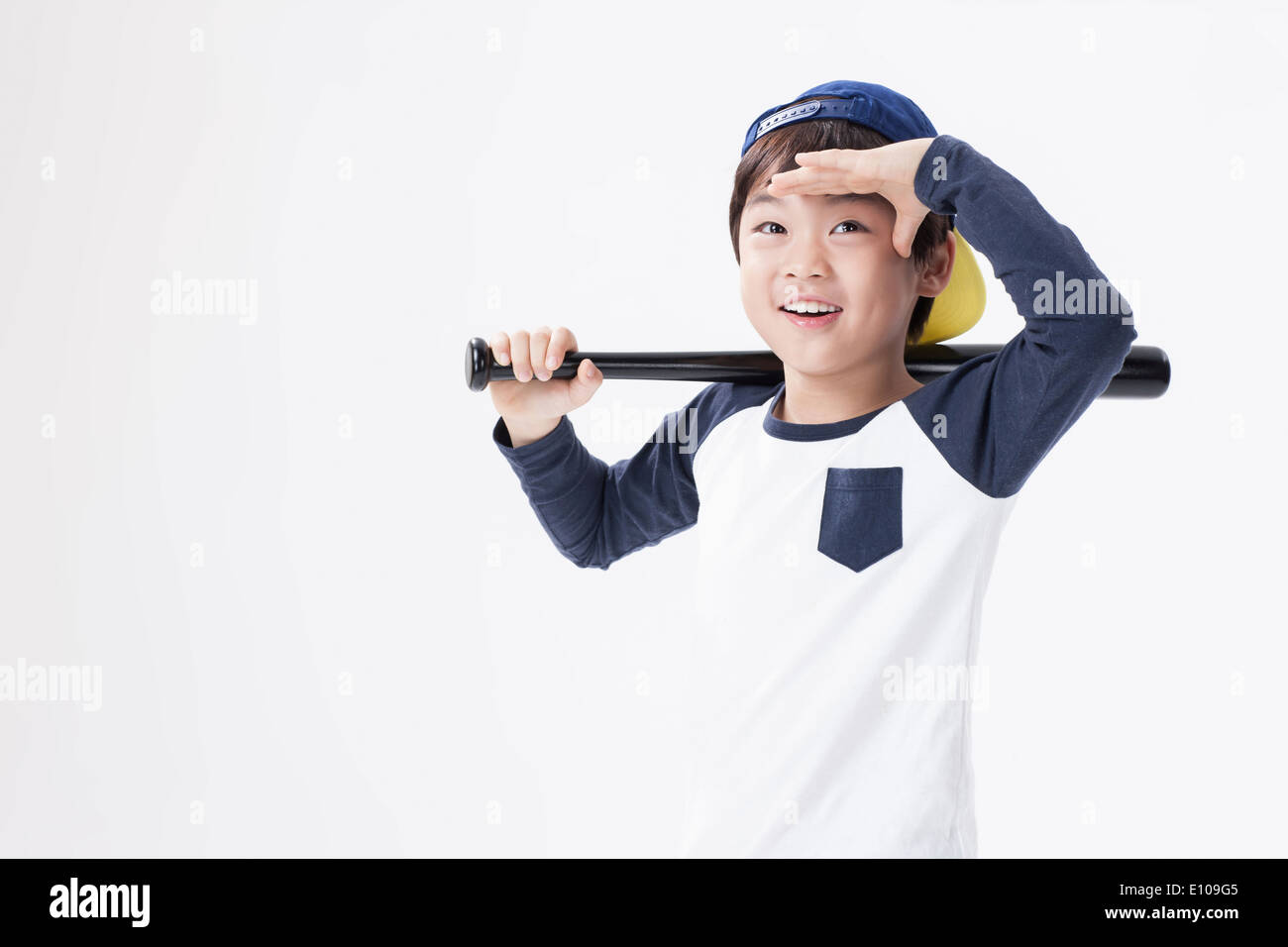 a young boy posing with a baseball bat Stock Photo - Alamy