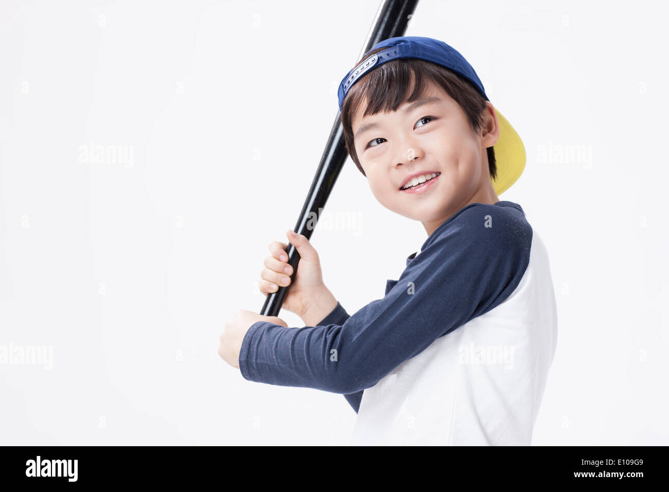 a young boy posing with a baseball bat Stock Photo - Alamy