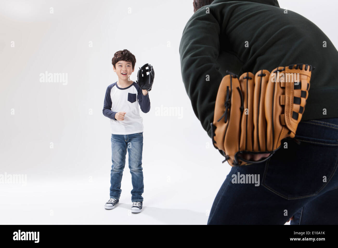 a father and a son playing catch Stock Photo - Alamy