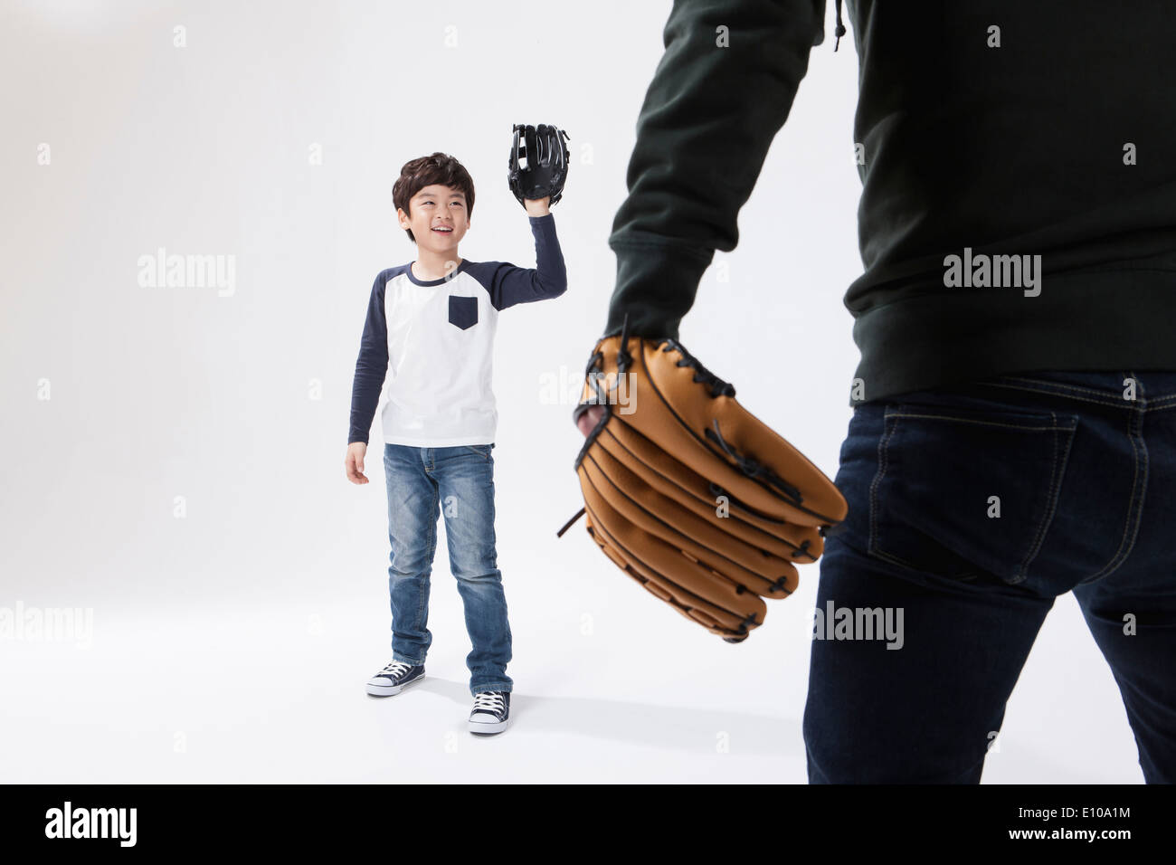 a father and a son playing catch Stock Photo - Alamy