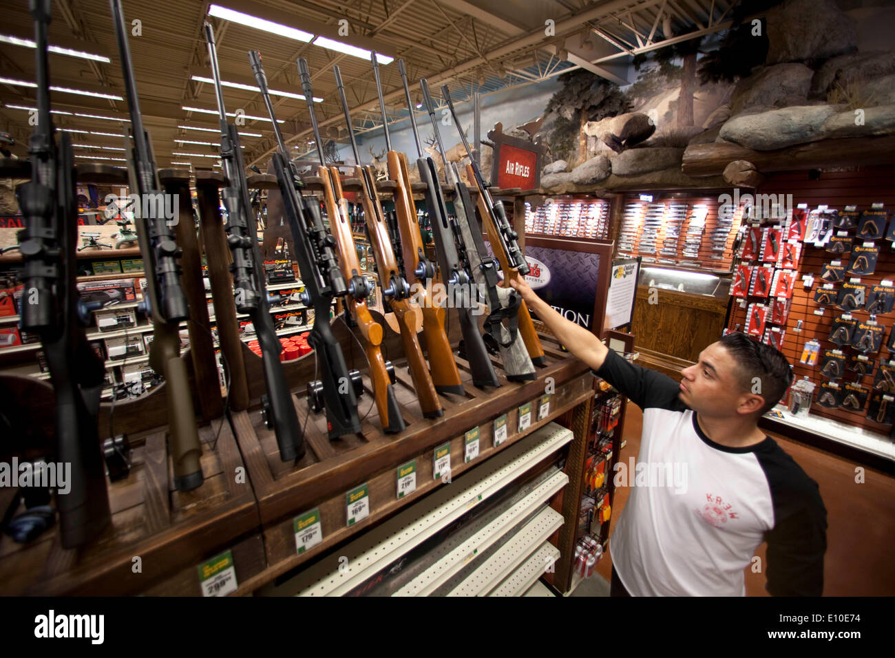 May 18 2014 Riverside California Us A Shopper Reaches For A Hunting Rifle On Sale In