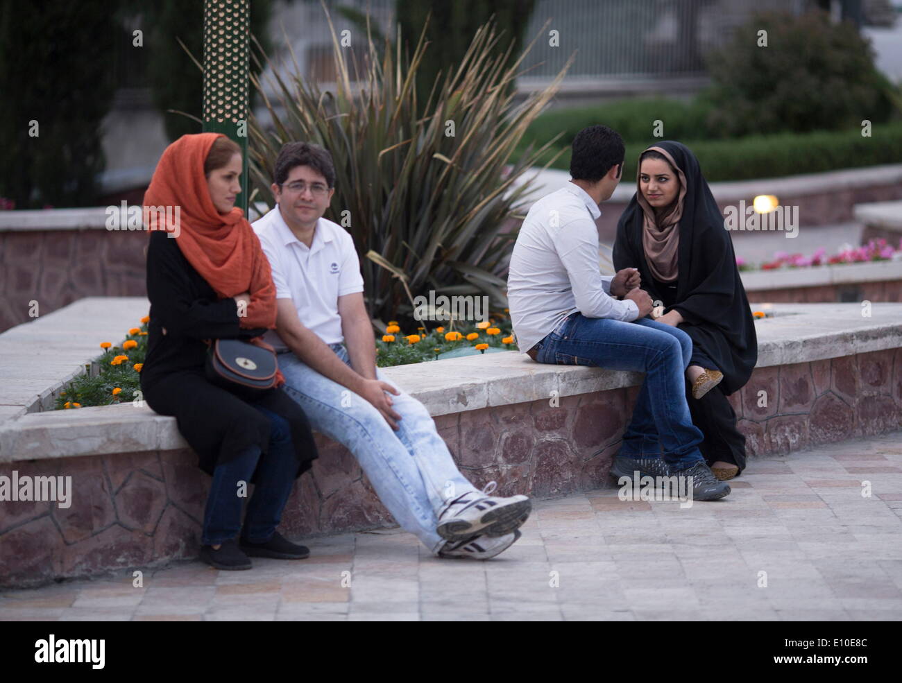May 20, 2014 - Tehran, Iran - Iranian couples sit on a corner of the ...