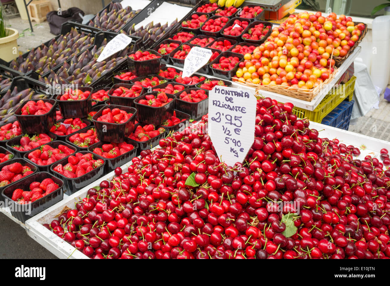 Market stall displaying an assortment of spring fruit Stock Photo - Alamy