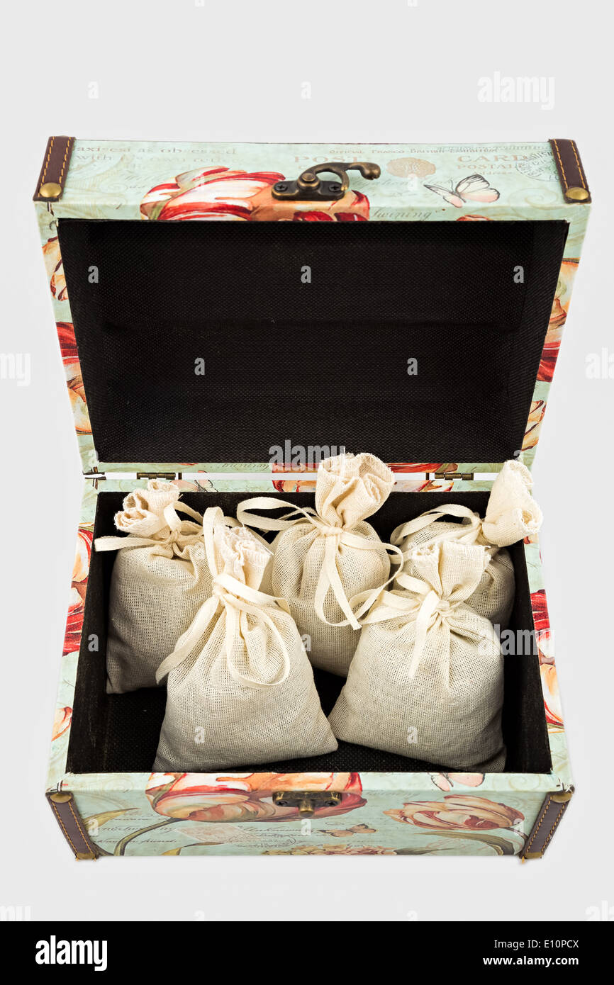 Gift box with textile pouches on white background Stock Photo - Alamy