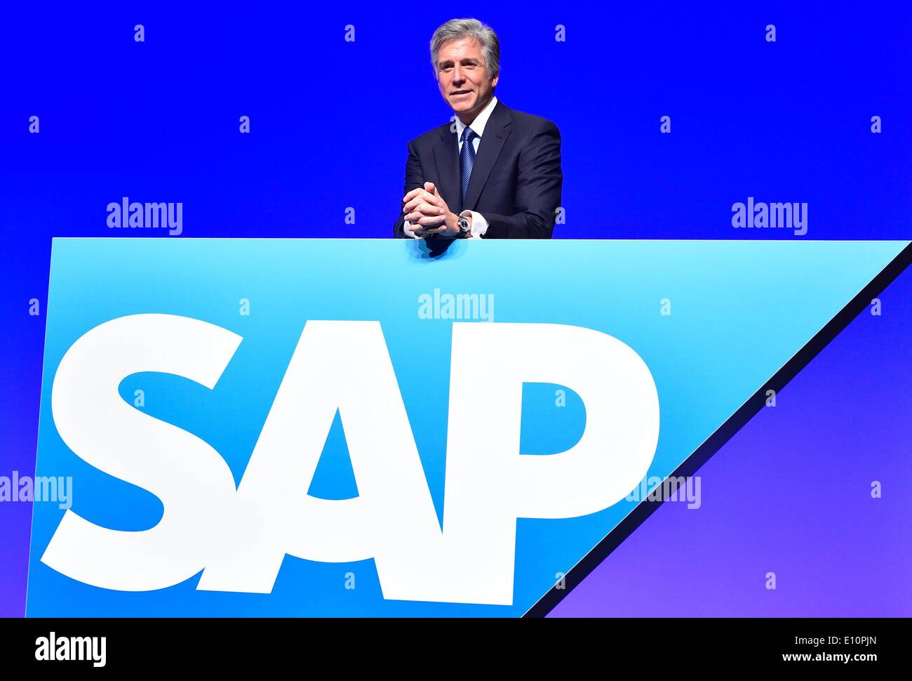 SAP spokesman of the management board Bill McDermott stands behind the ...