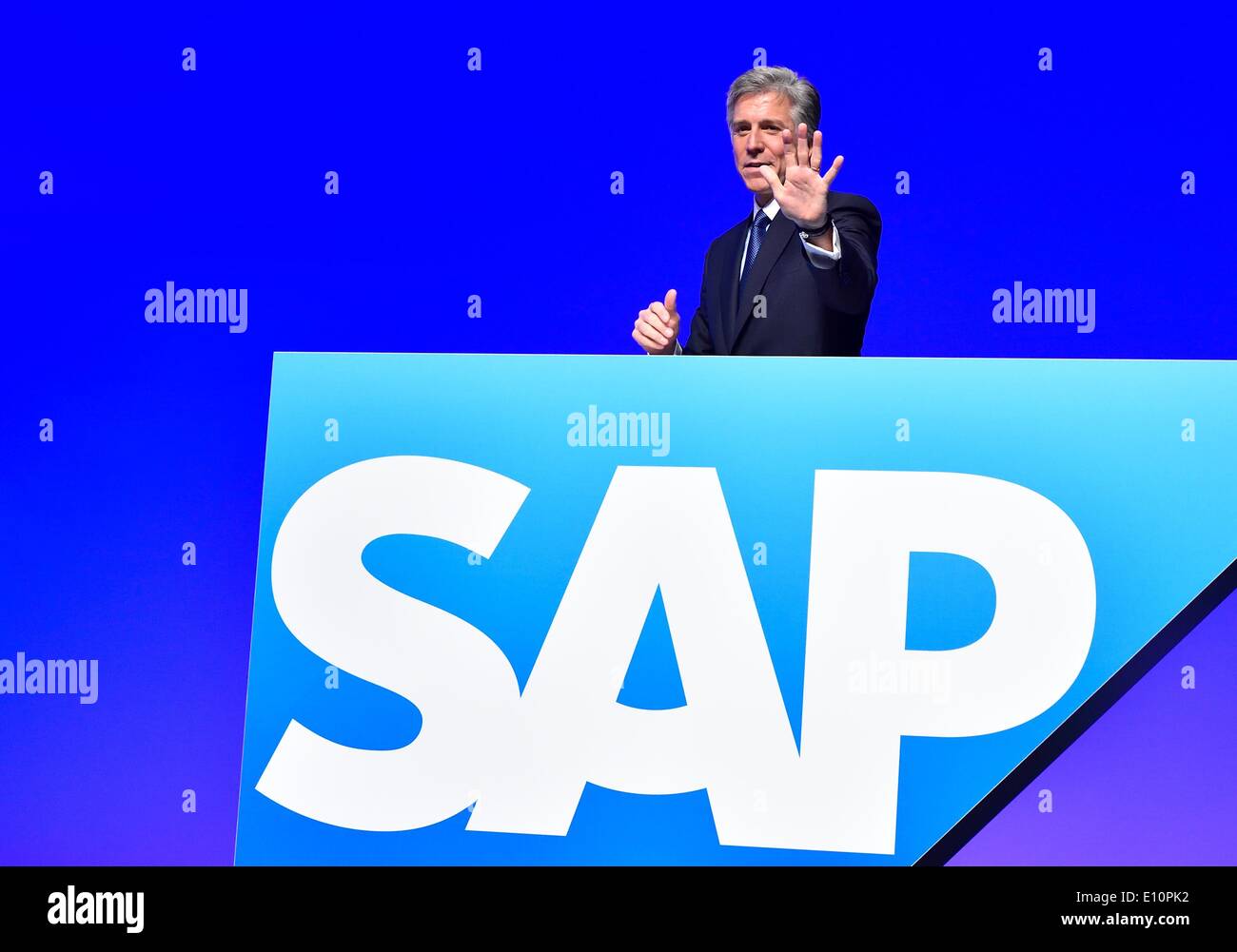 SAP spokesman of the management board Bill McDermott stands behind the ...