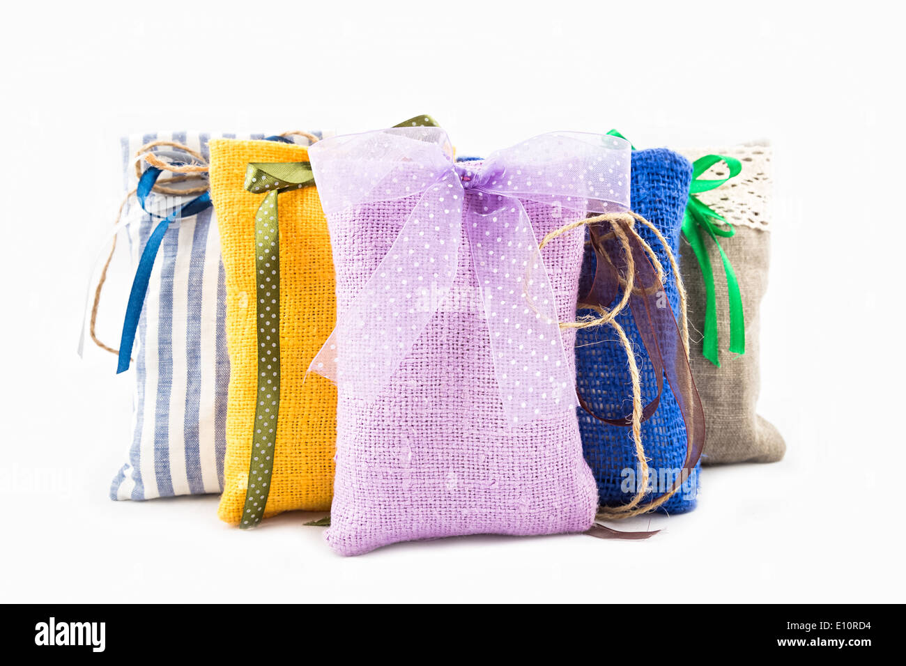 Decorative textile sachet pouches on white background Stock Photo - Alamy