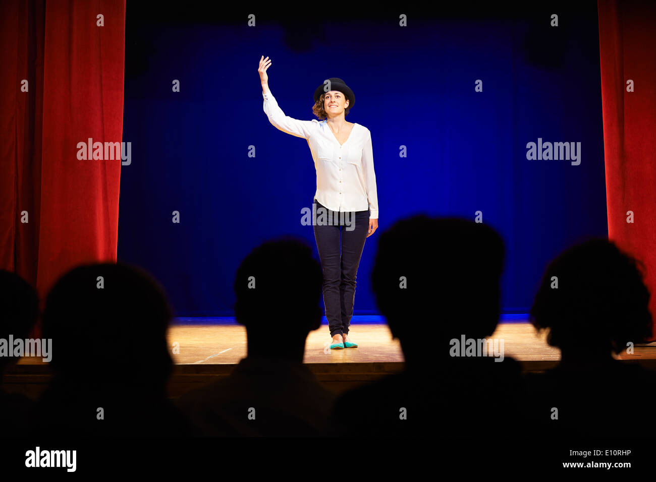 Arts and entertainment in theatre with actress on stage acting in play ...