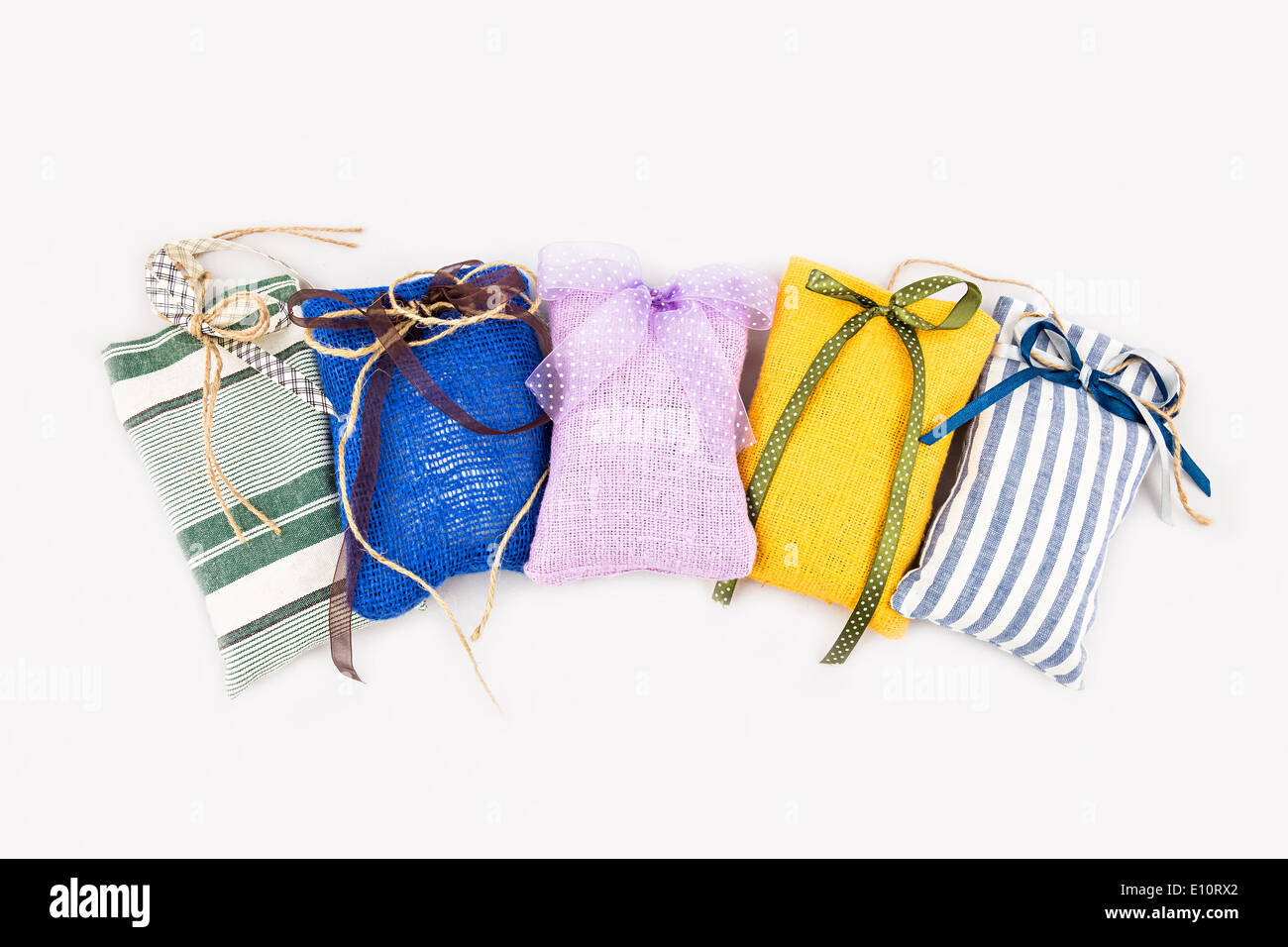 Decorative textile sachet pouches on white background Stock Photo - Alamy
