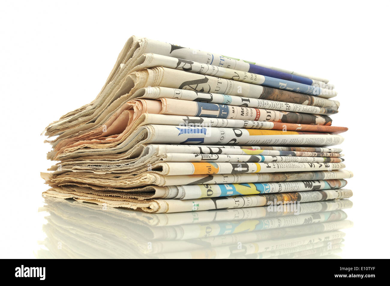 Stack of newspapers on white background Stock Photo - Alamy