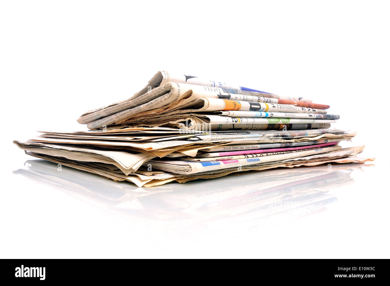 Stack of newspapers on white background Stock Photo - Alamy