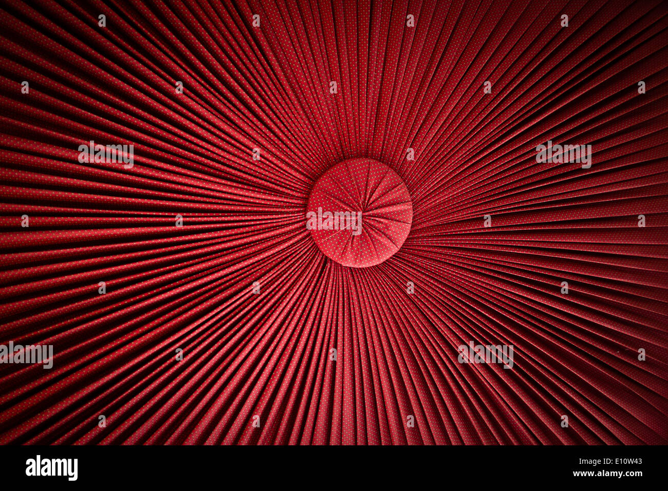 A red fabric intricate pleated ceiling rose in a hotel room uk Stock ...