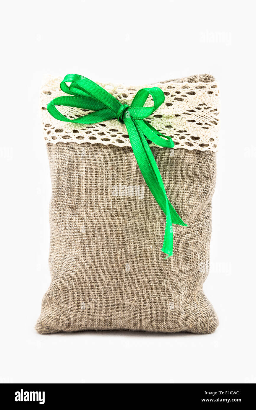 Decorative textile sachet pouch with a ribbon and bow on white ...