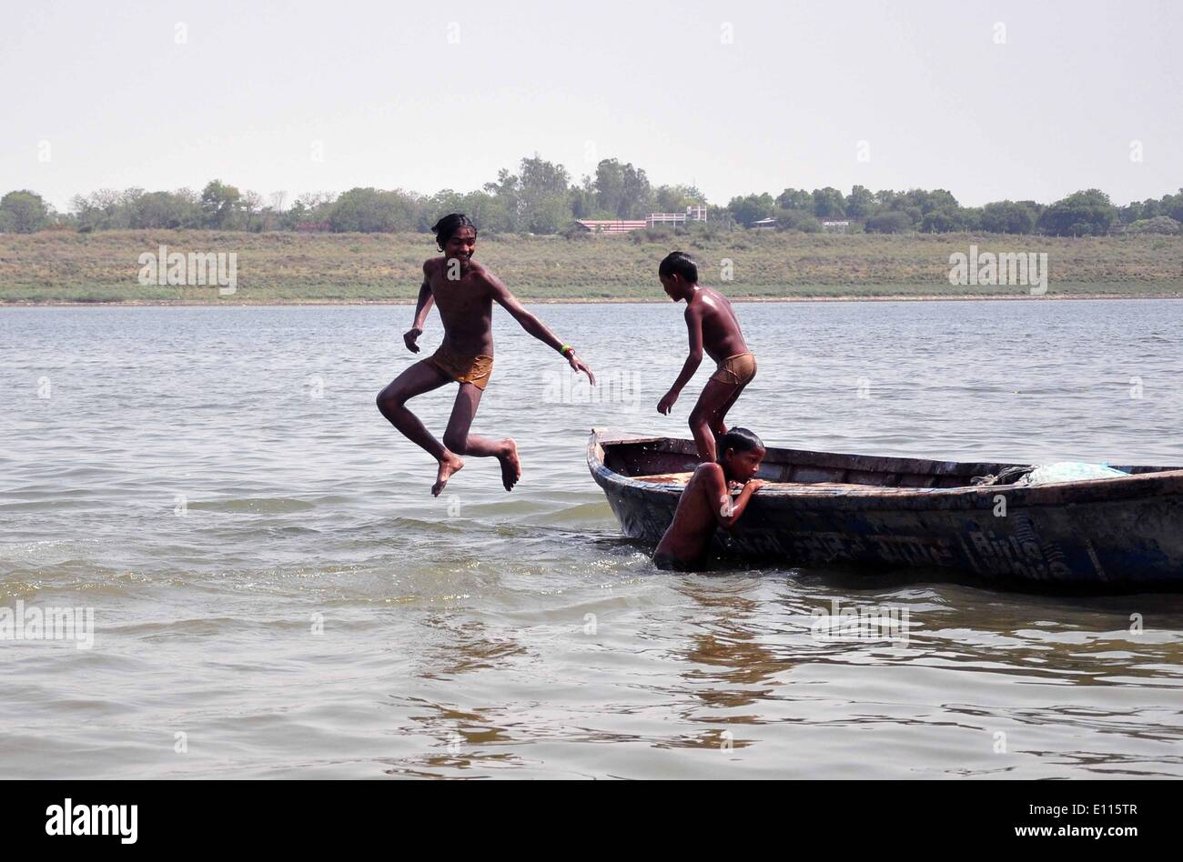 ALLAHABAD, INDIA-MAY 21: Children diving in River Yamuna during a hot ...