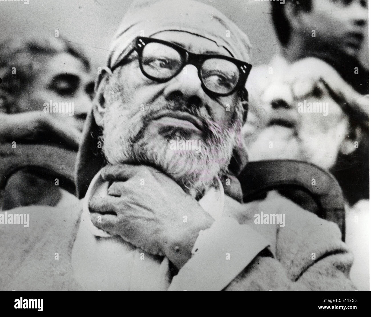 Mr. RAJ NARAIN listens to a speaker at a rally. Exact date unknown ...