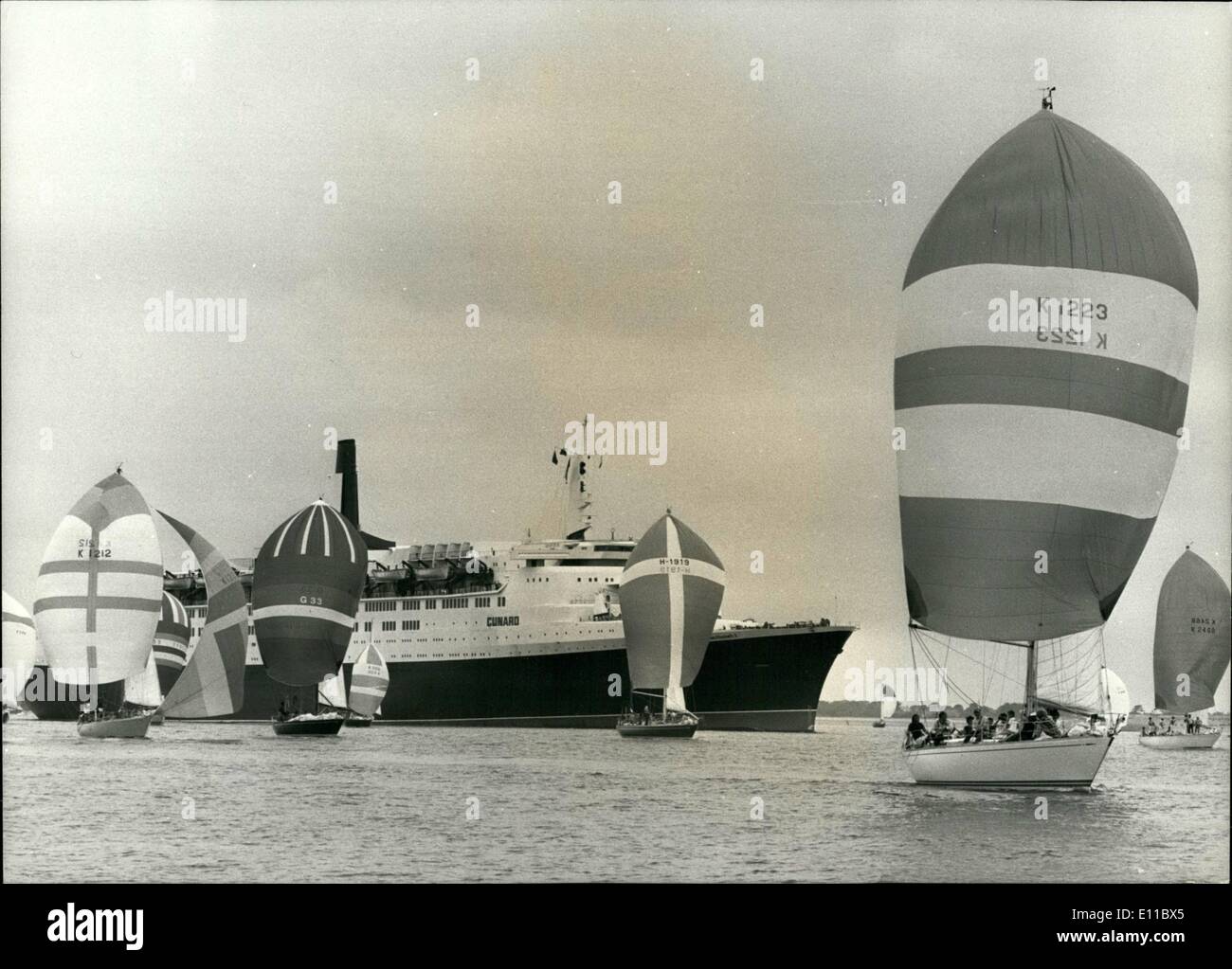 Aug. 08, 1976 - QE2 Waits For Yachts At Cowes: The QE2 framed by yachts ...