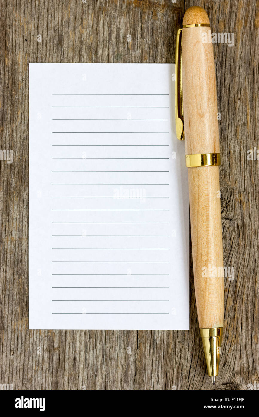 Wooden pen and note paper for your own text Stock Photo - Alamy