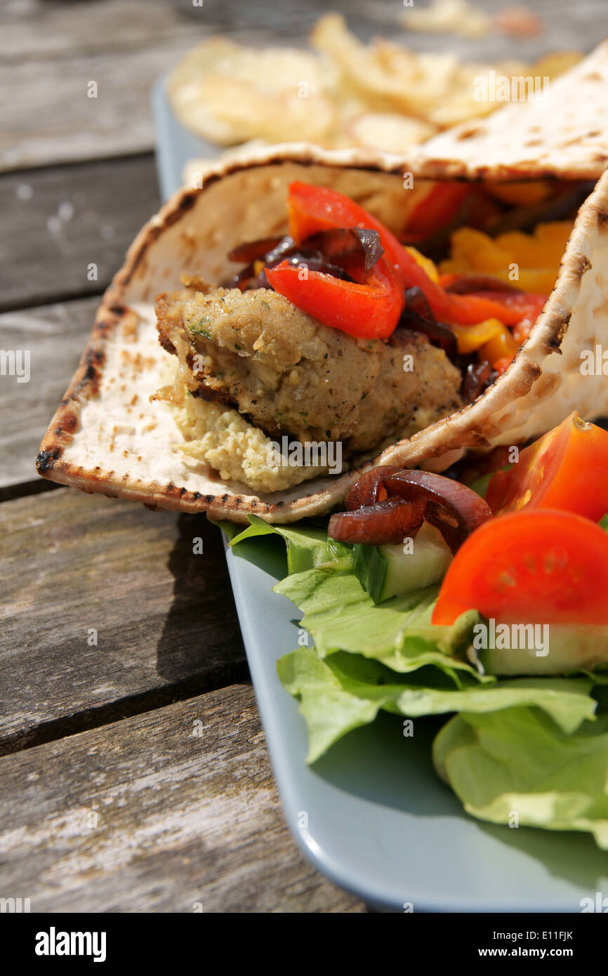 Flat bread with Falafel Hummus roasted peppers served with salad ...