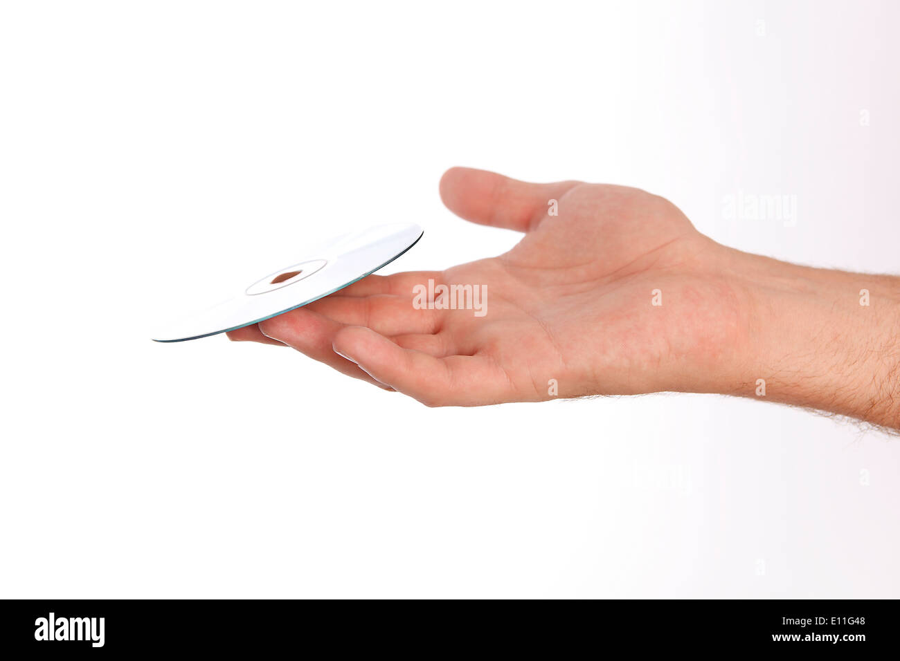 Male hand holds compact disc Stock Photo - Alamy