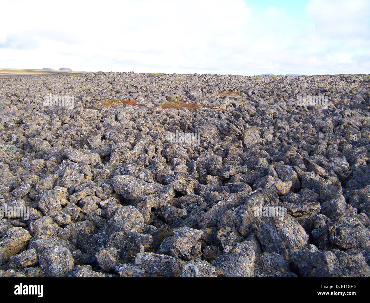 The basaltic lava flow in Alaska offers a stark, rugged landscape where ...