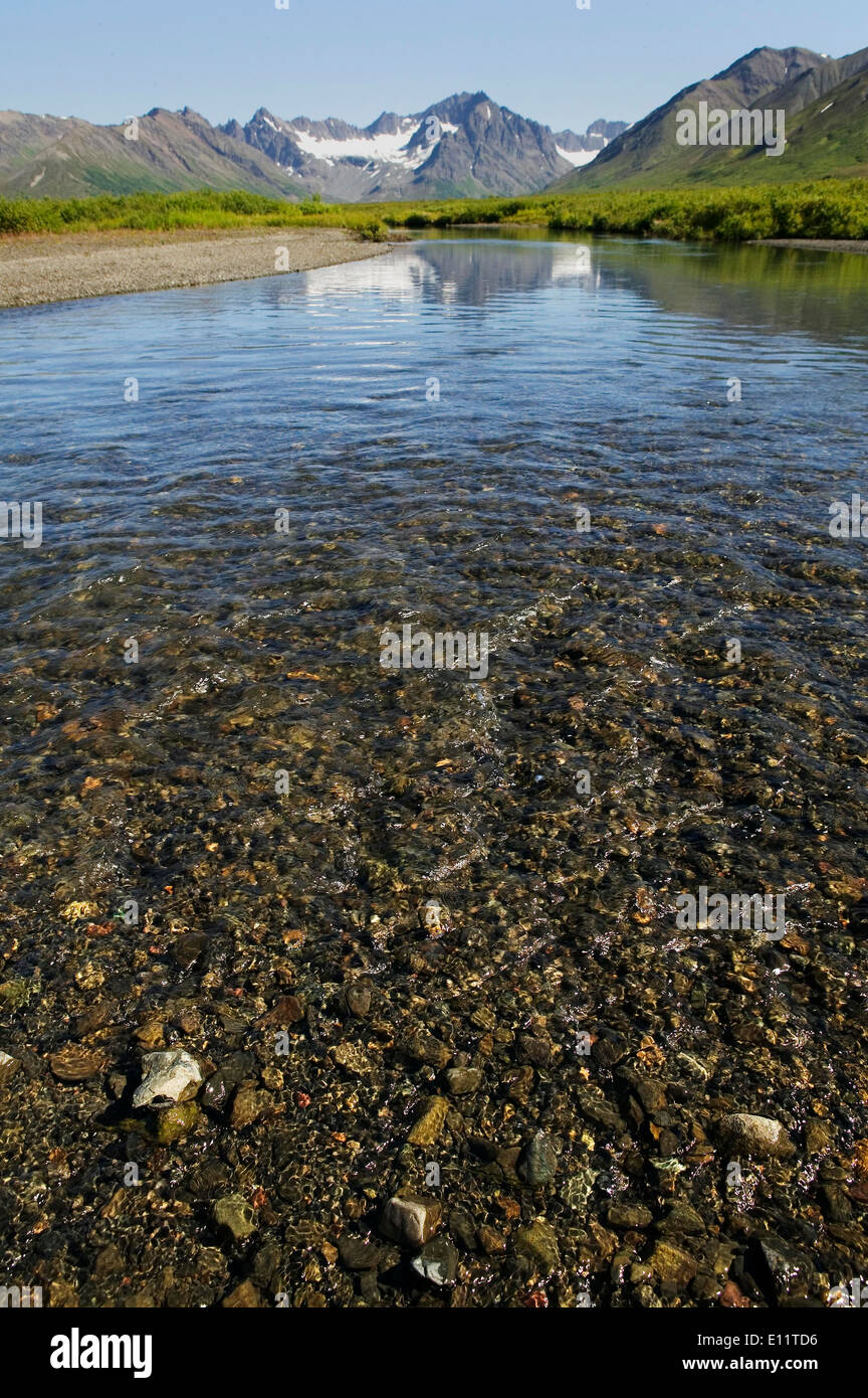 The image depicts a landscape with a peaceful, natural setting ...