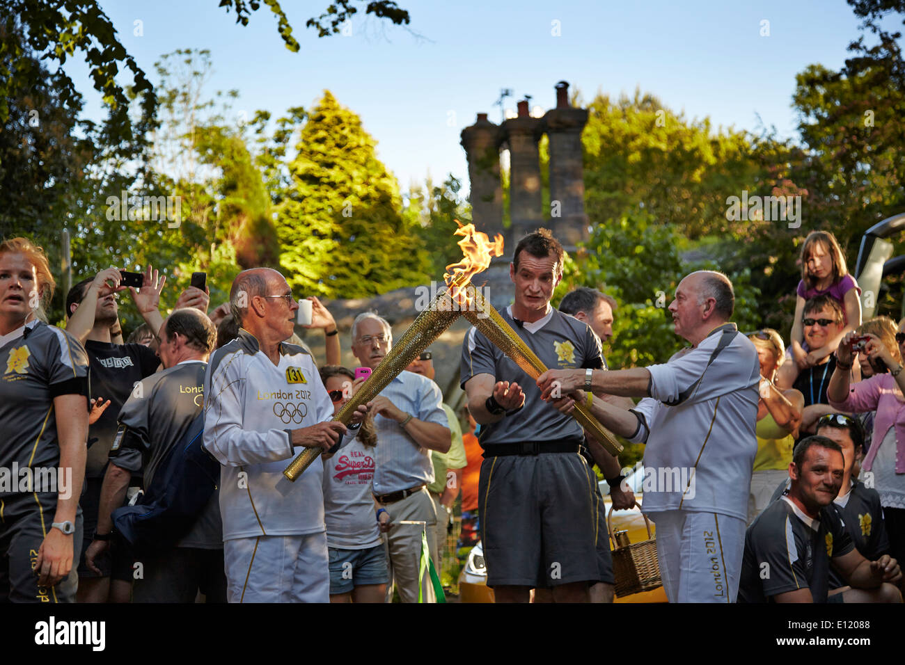 Kendrick Bennett, on the right, ignite the Olympic torch in Singleton ...