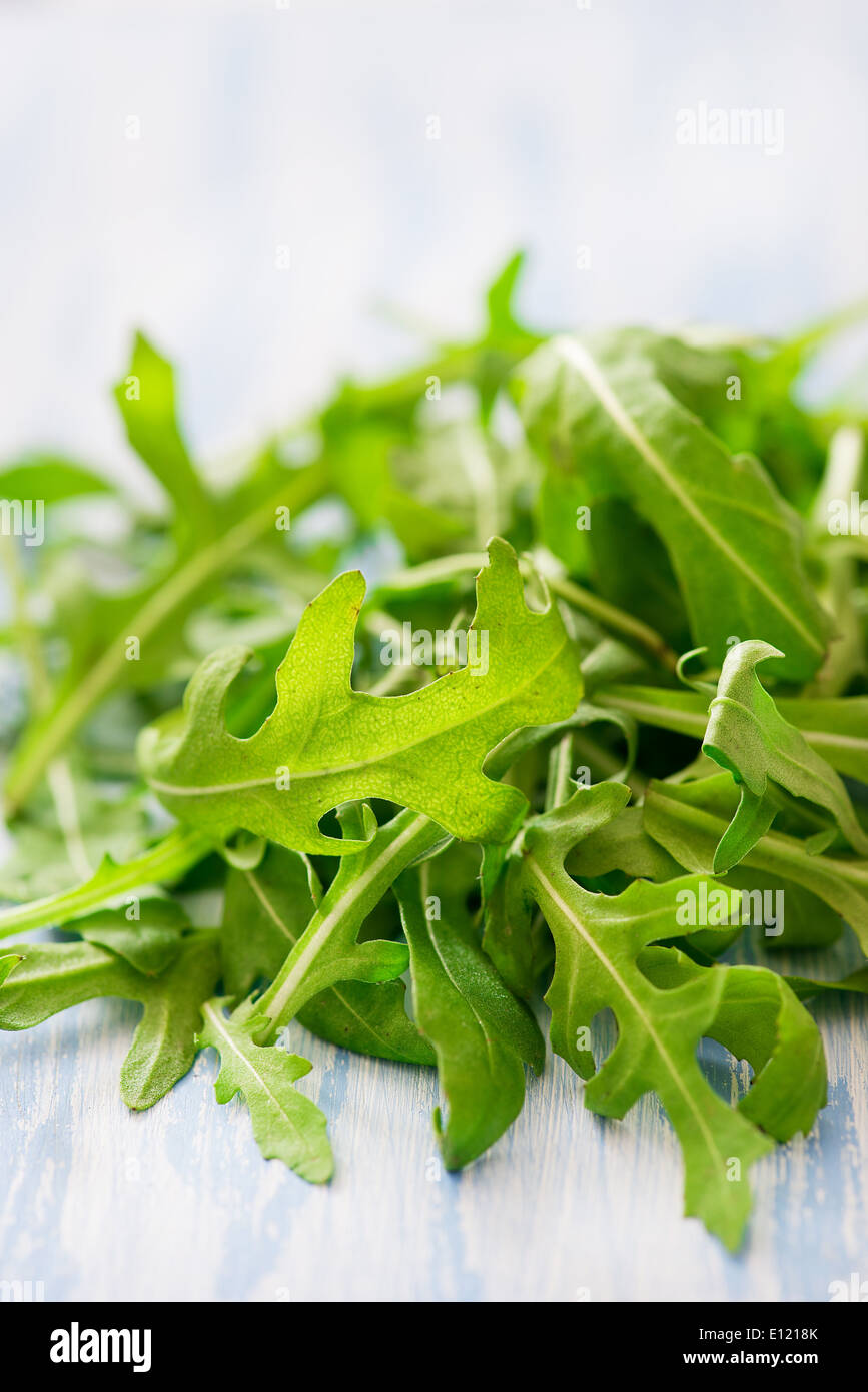 Fresh arugula over light background, selective focus Stock Photo - Alamy
