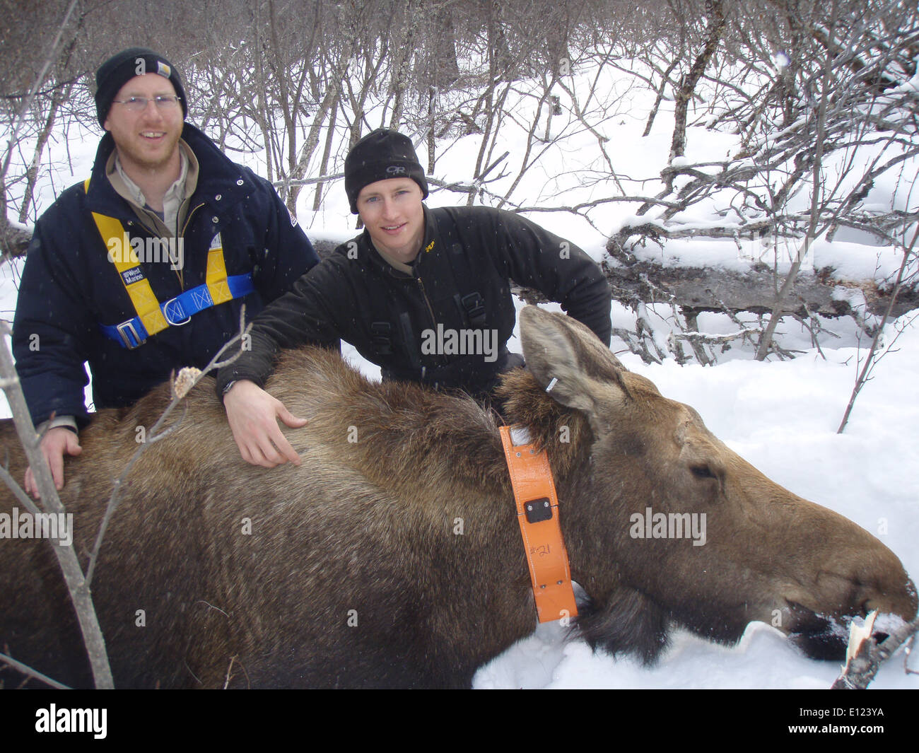 Isaac and Eric are pictured in a conservation or wildlife management ...
