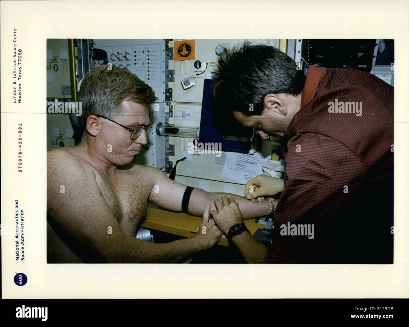 Jun. 06, 1996 - Astronaut Richard M. Linnehan prepares to draw blood ...