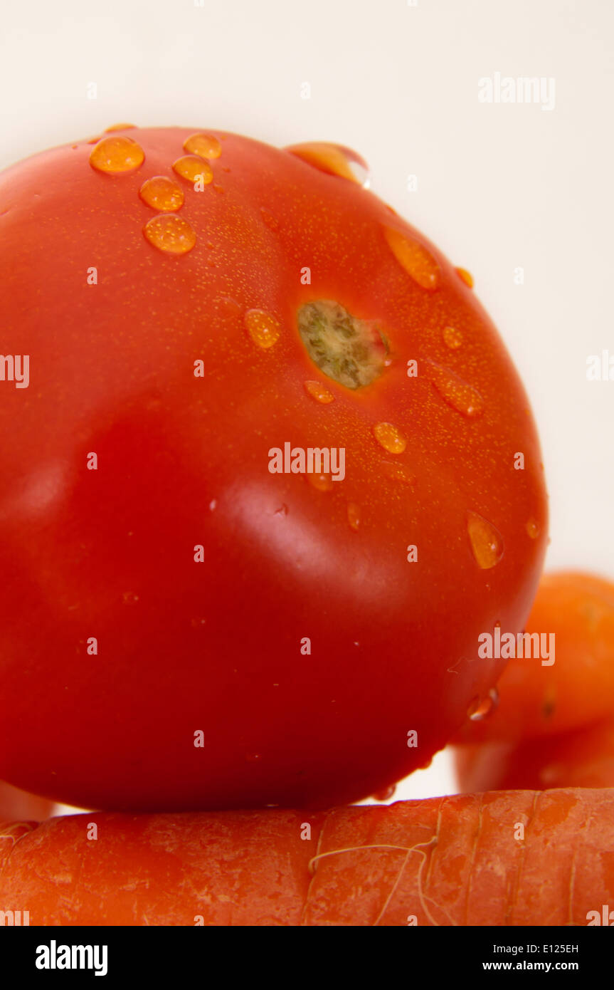 Tomato with drops Stock Photo - Alamy