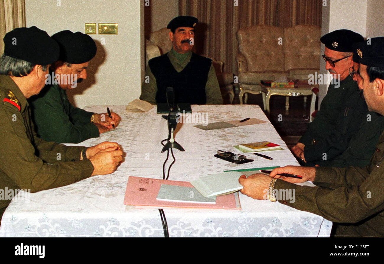 SADDAM HUSSEIN chairs a meeting of his Revolutionary Command Council ...